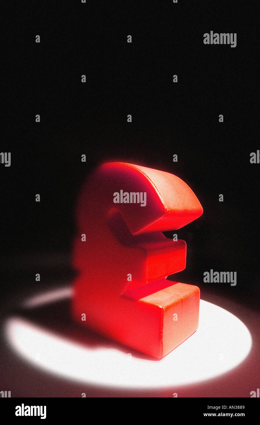 Conceptual image. Red pound sign in spotlight with a black background ...