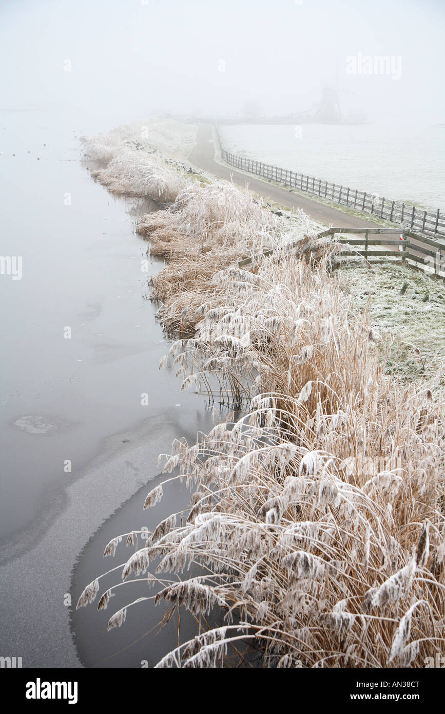 Winter landscape with windmill and river in South Holland, The ...