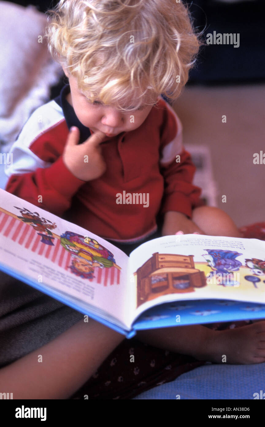 Toddler reading a children's picture book, UK Stock Photo - Alamy