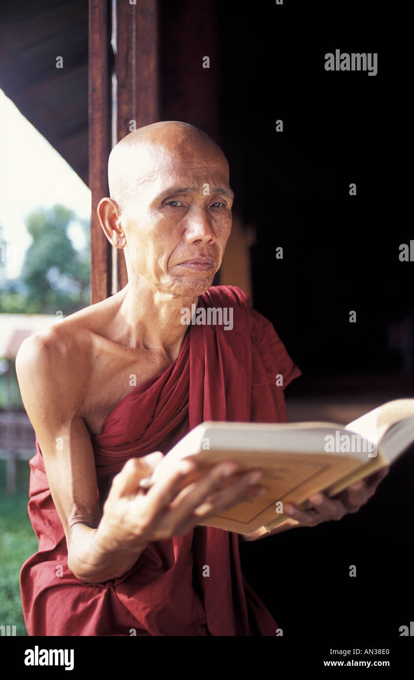 The abbot of a local monastery reading from his prayer book Shan State ...