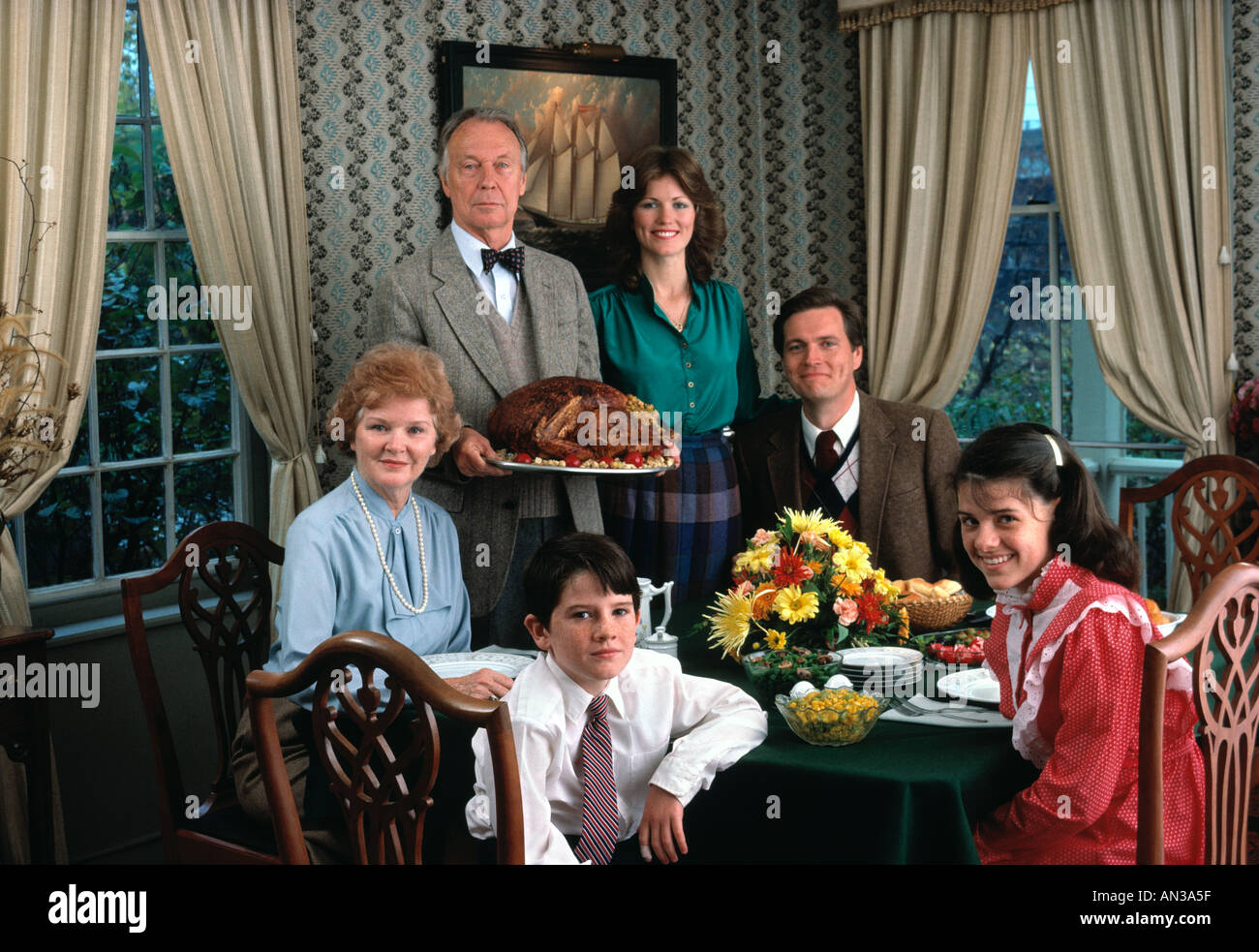 70s portrait of Three 3 generations family sitting down to Thanksgiving ...