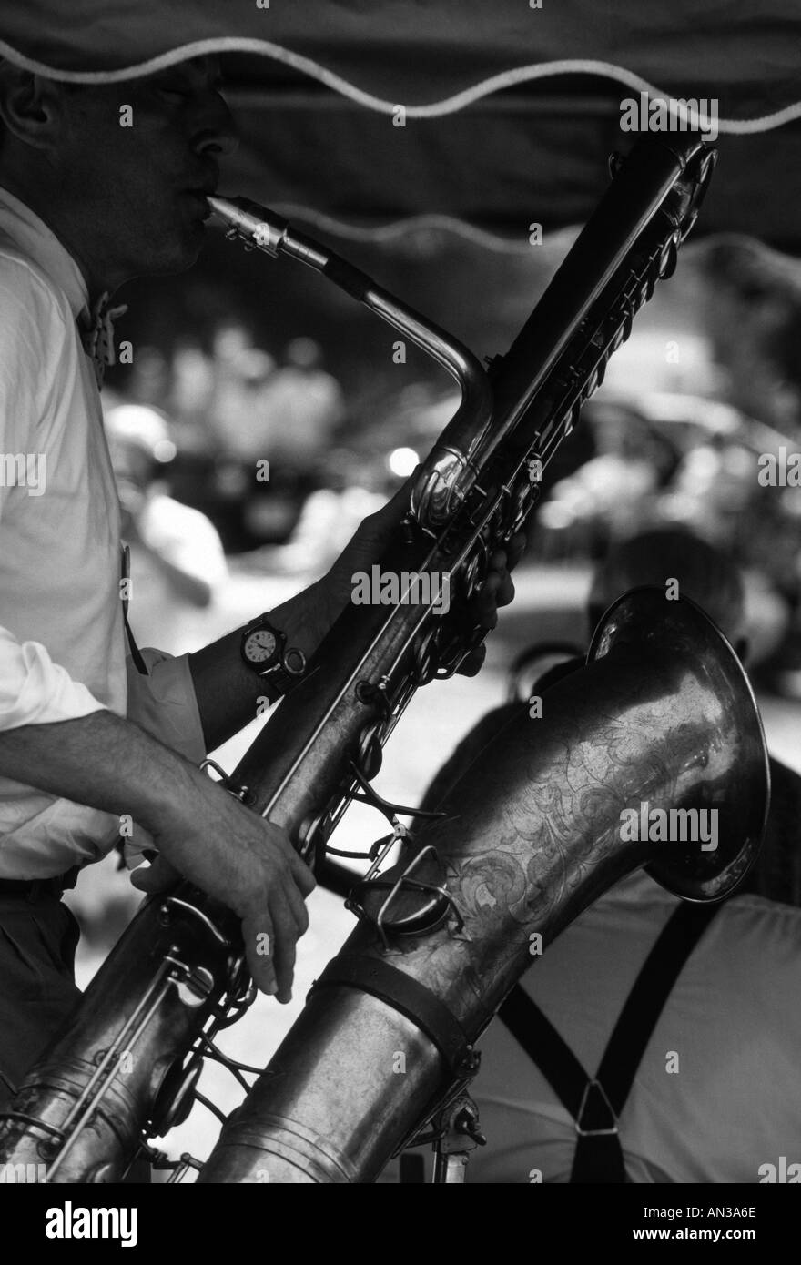 black and white caucsian musician playing baritone saxophone at the Bix ...