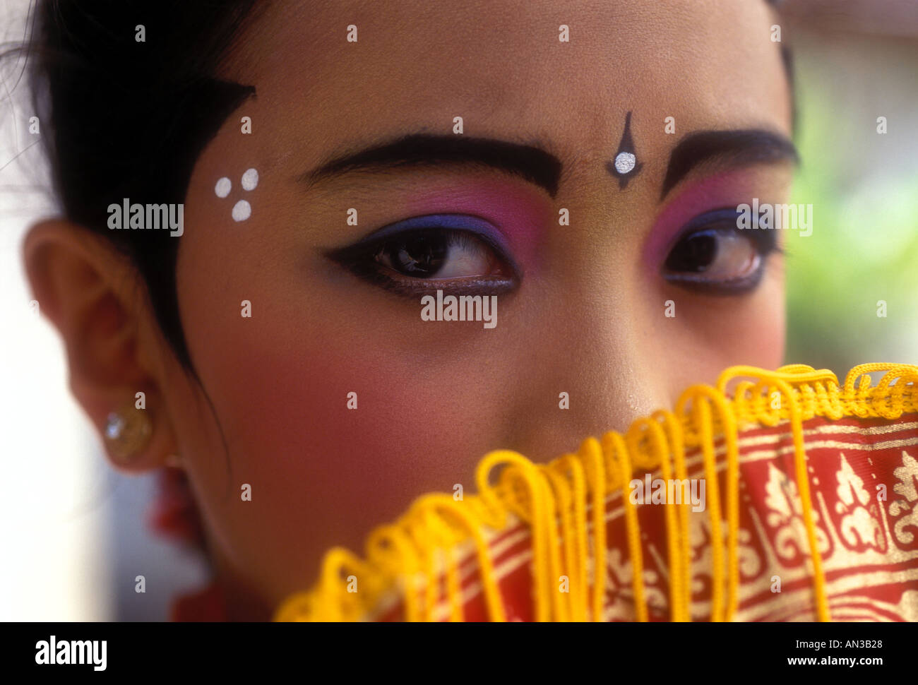 Decorated face of Balinese legong dancer on the island of Bali in ...
