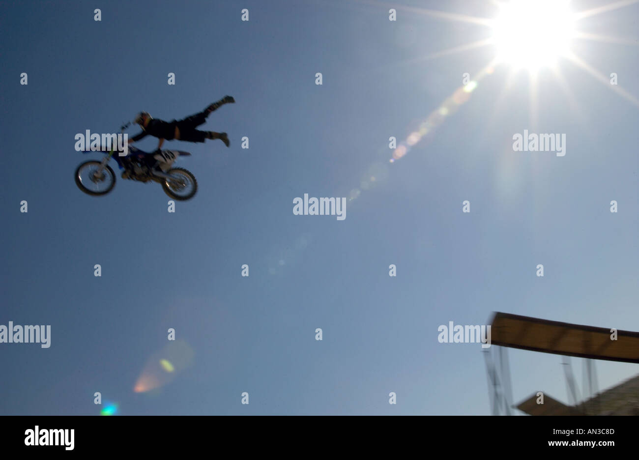 Motocross riders jumping a ramp Stock Photo - Alamy
