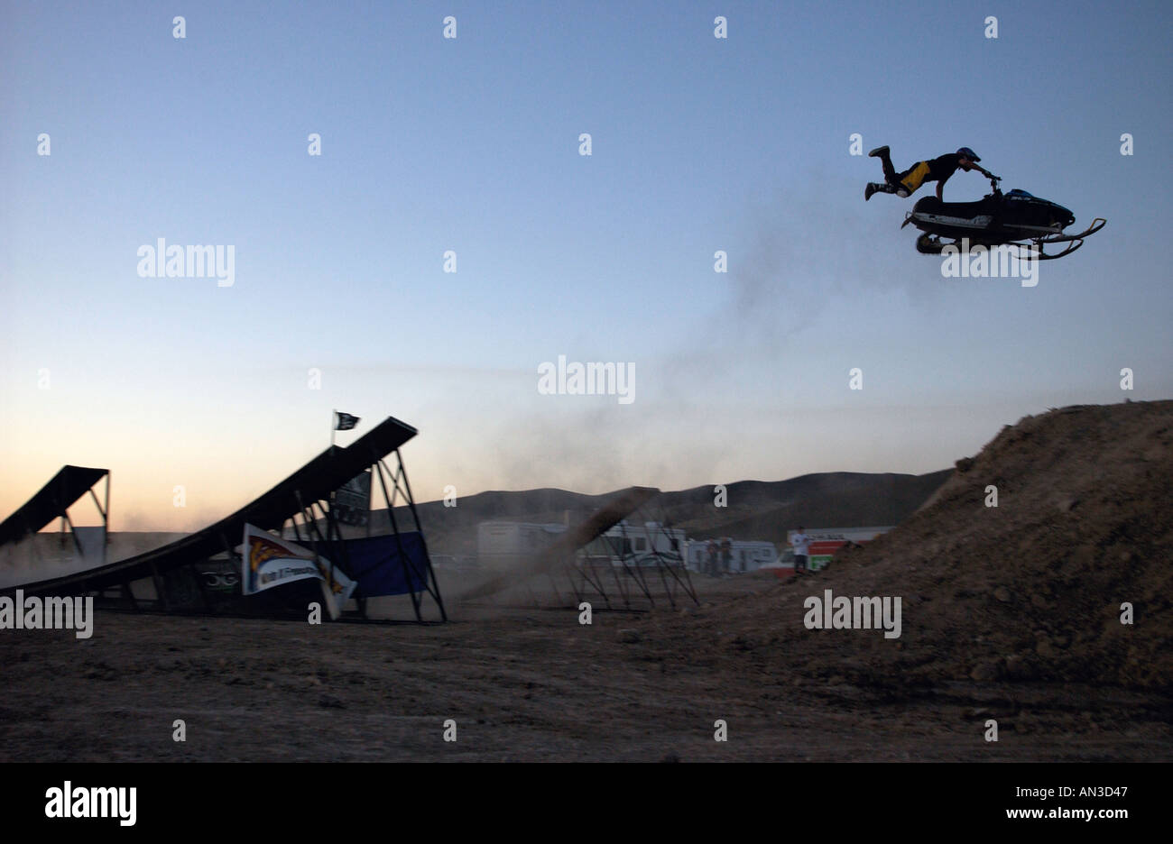 A snowmobiler riding in the dirt Stock Photo - Alamy