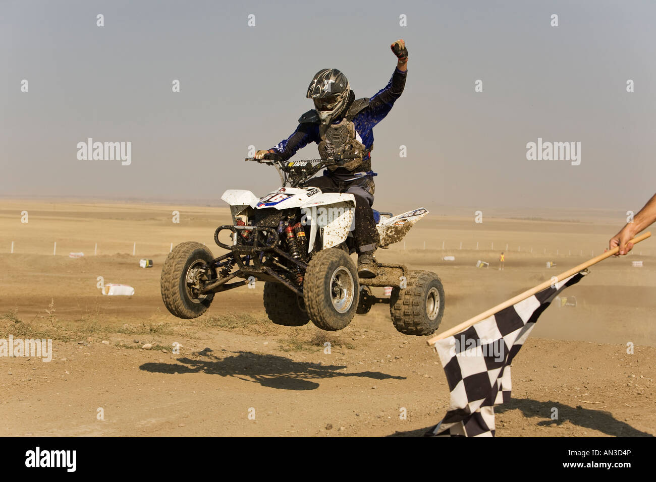 A quad racer crossing the finish line Stock Photo - Alamy