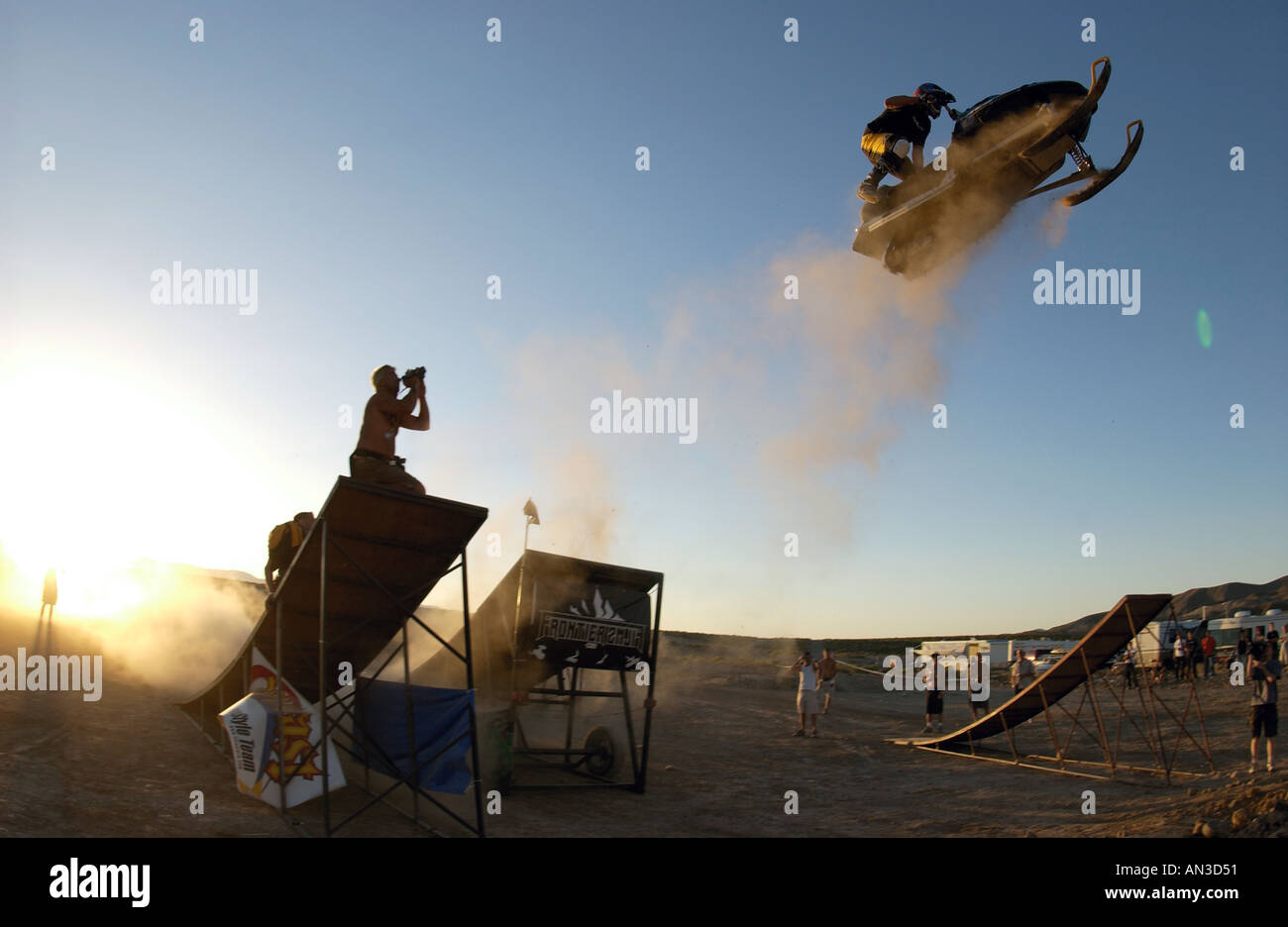 A snowmobiler riding in the dirt Stock Photo - Alamy