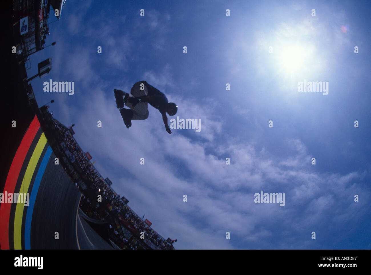A street in line skater jumps off a ramp Stock Photo - Alamy