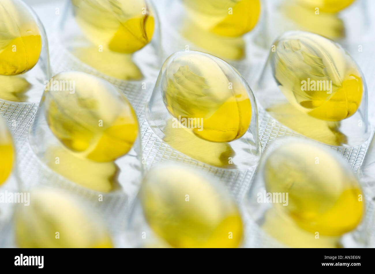 yellow medicine pill Stock Photo - Alamy