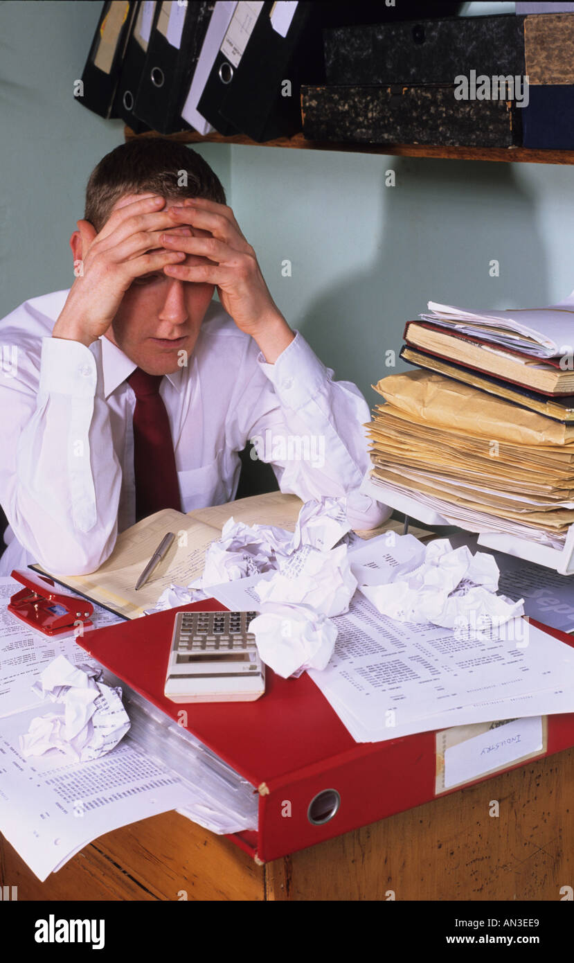 Man buried in paperwork hi-res stock photography and images - Alamy
