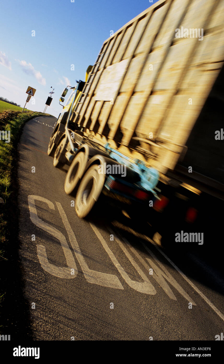 lorry passing slow down road markings near leeds uk Stock Photo - Alamy