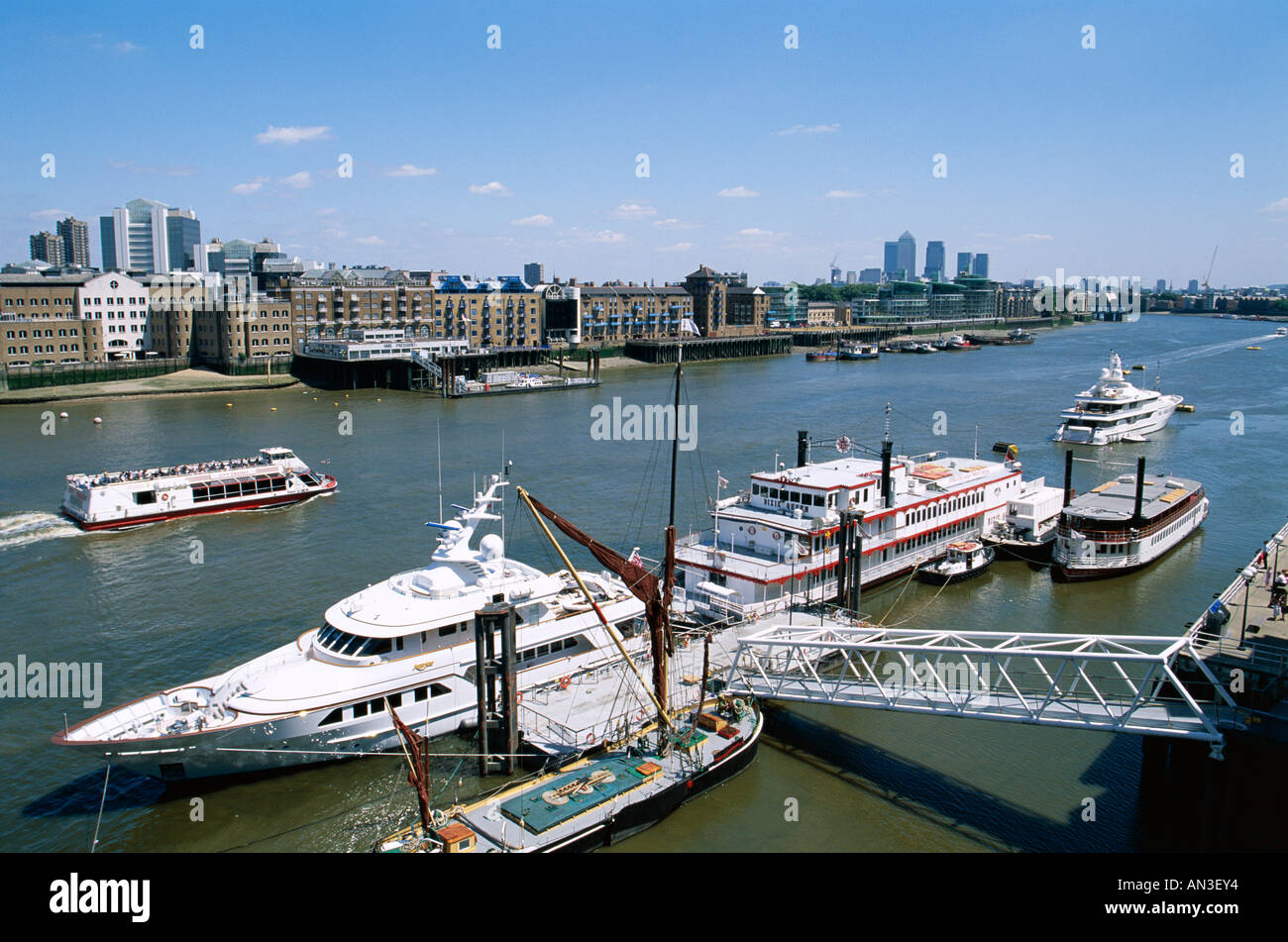 Boats on Thames River & Docklands Skyline, London, England Stock Photo ...