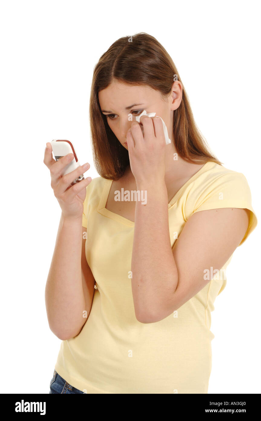 a teenage girl crying with her mobile phone Stock Photo - Alamy