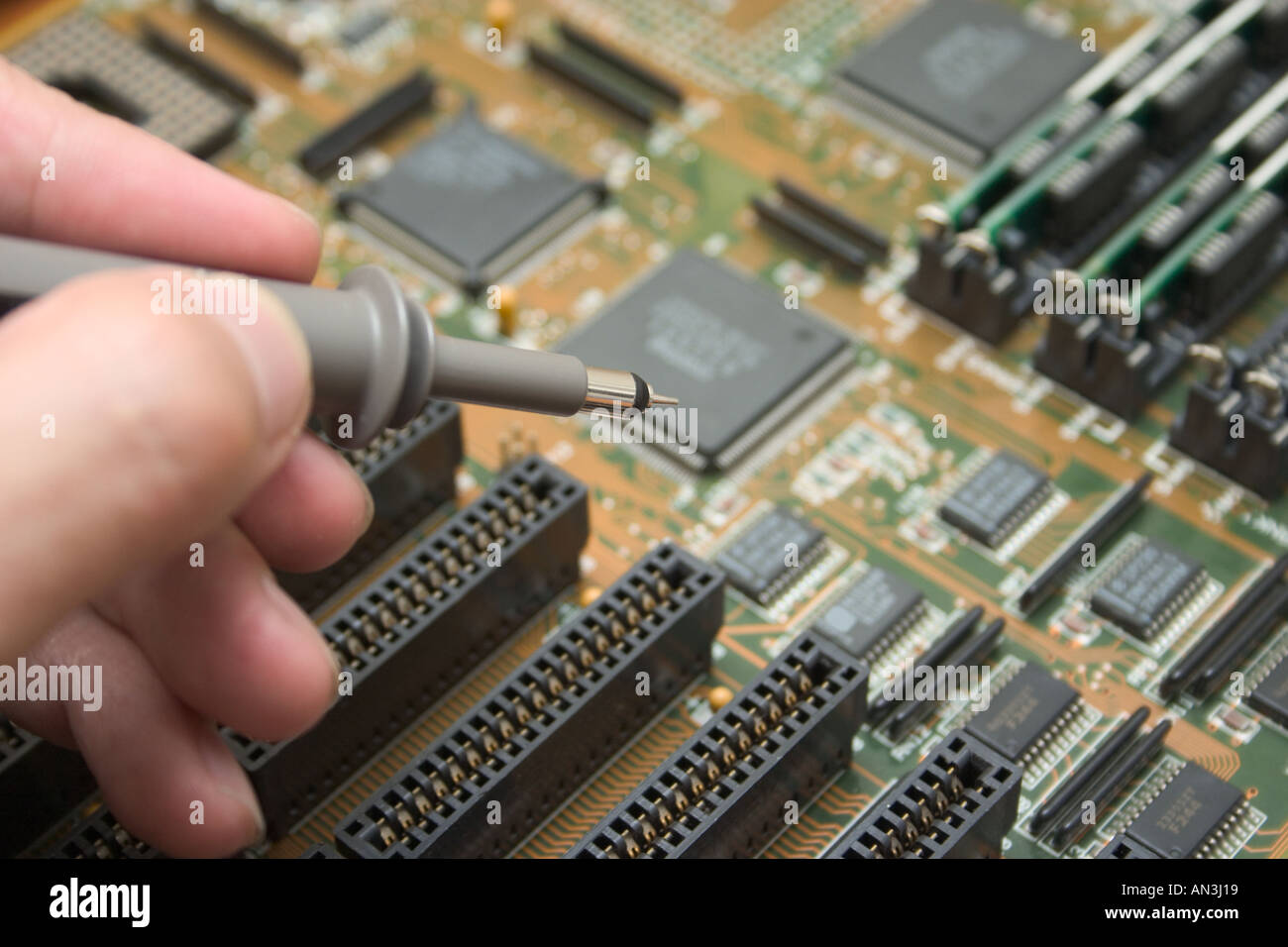 hand with probe testing electronic circuit board Stock Photo - Alamy