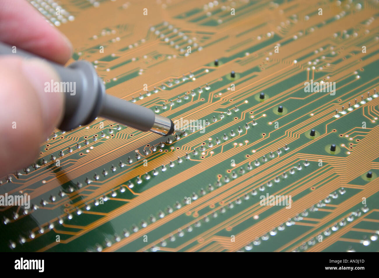 hand with probe testing electronic circuit board Stock Photo - Alamy