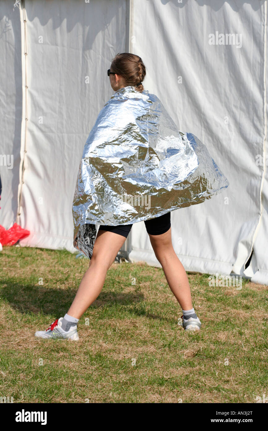 Runner warming up and stretching before race Stock Photo - Alamy