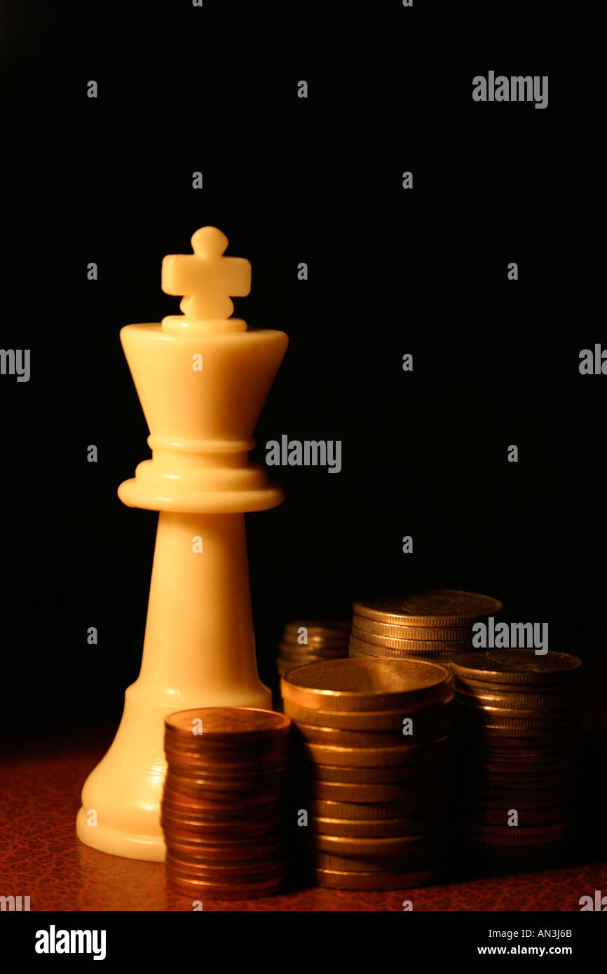 chess king and stacks of coins Stock Photo - Alamy