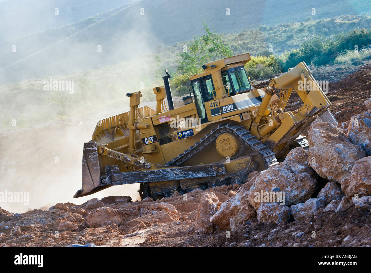 Bulldozer at work in Spain road making Stock Photo - Alamy