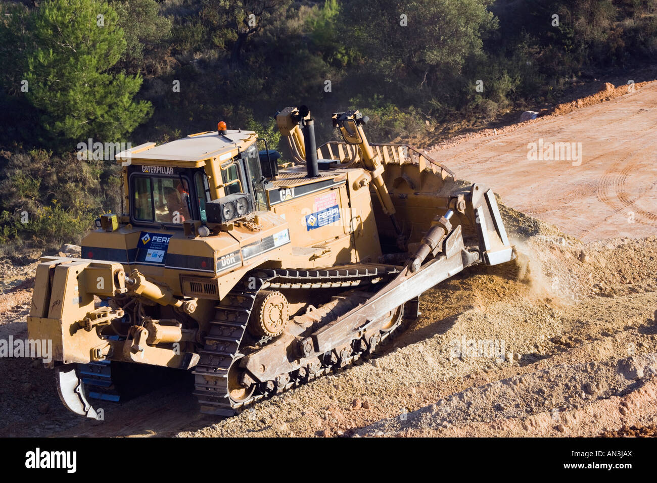 Bulldozer at work in Spain road making Stock Photo - Alamy