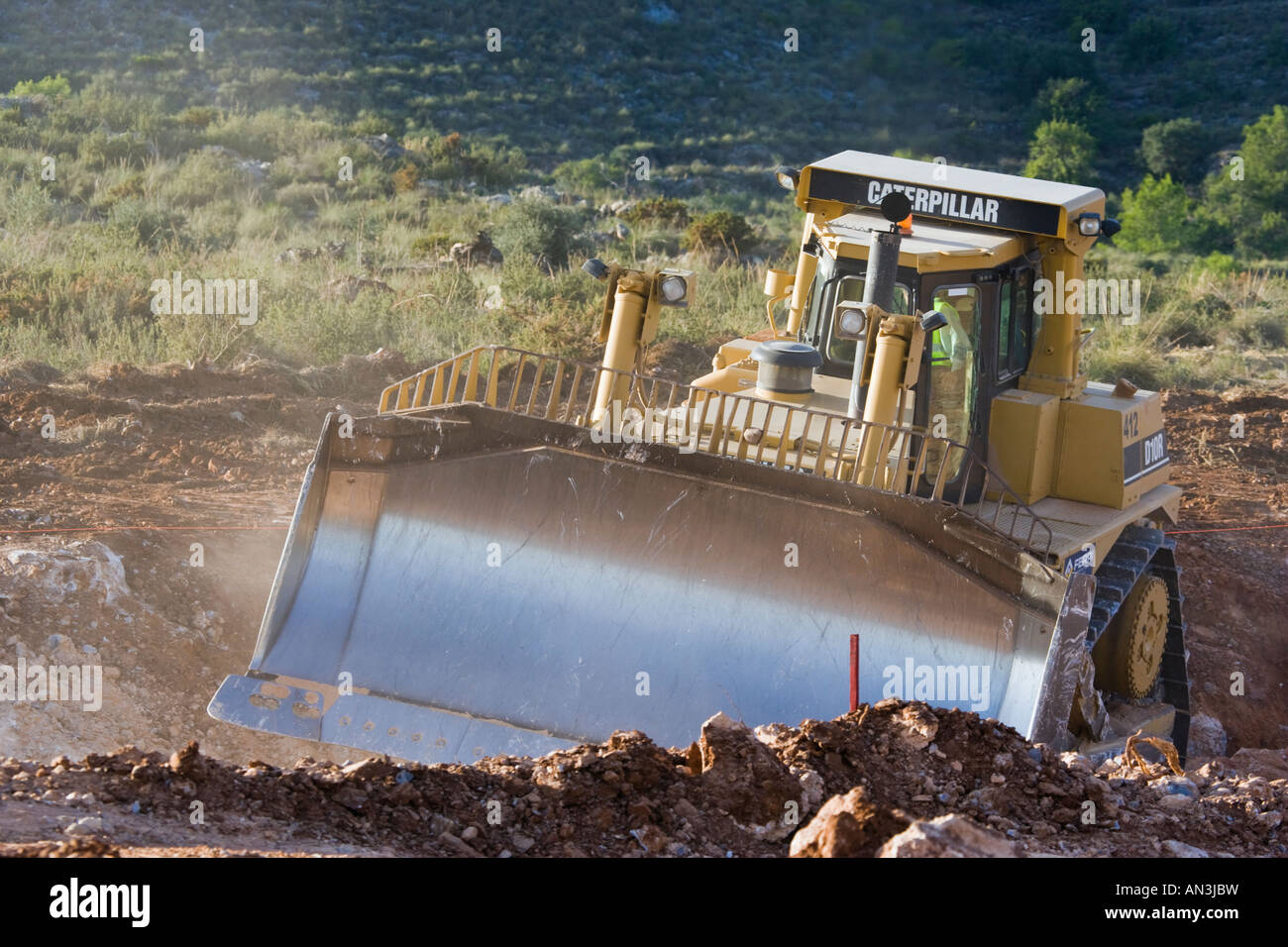 Bulldozer at work in Spain road making Stock Photo - Alamy