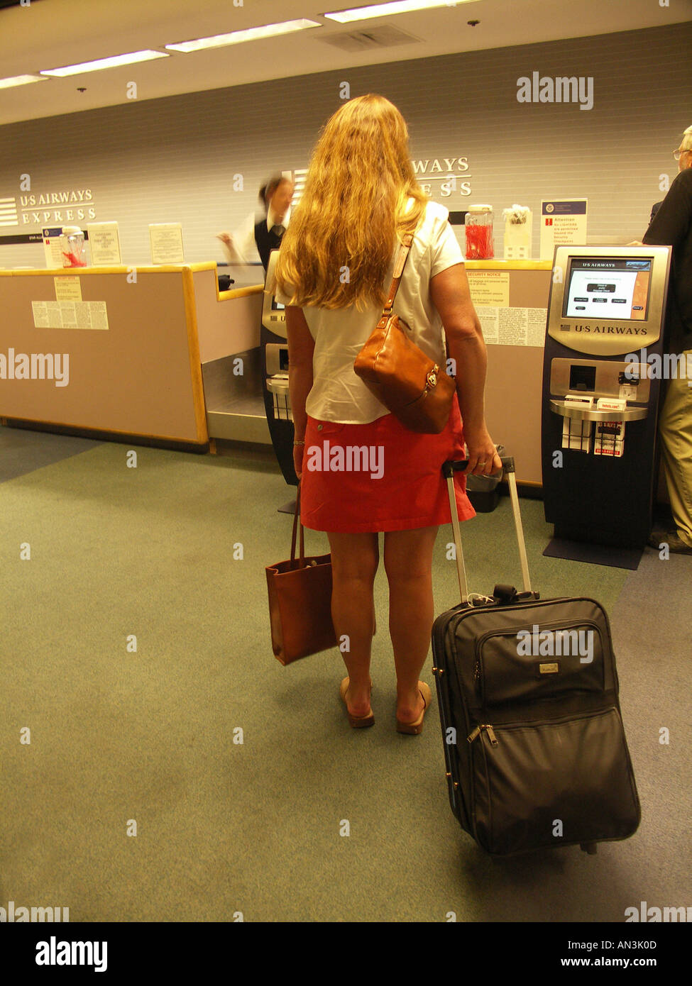 Checking in at Airport Stock Photo - Alamy