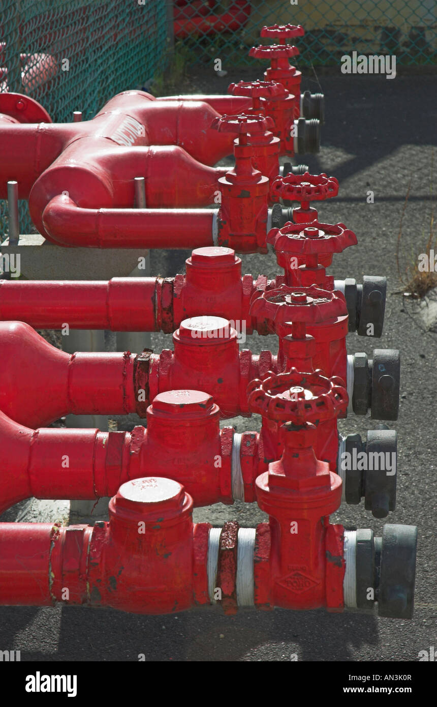 Red fire hydrants at industrial site Stock Photo - Alamy
