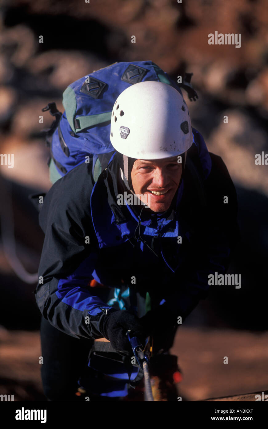 Rock climber ascending a rope Stock Photo - Alamy