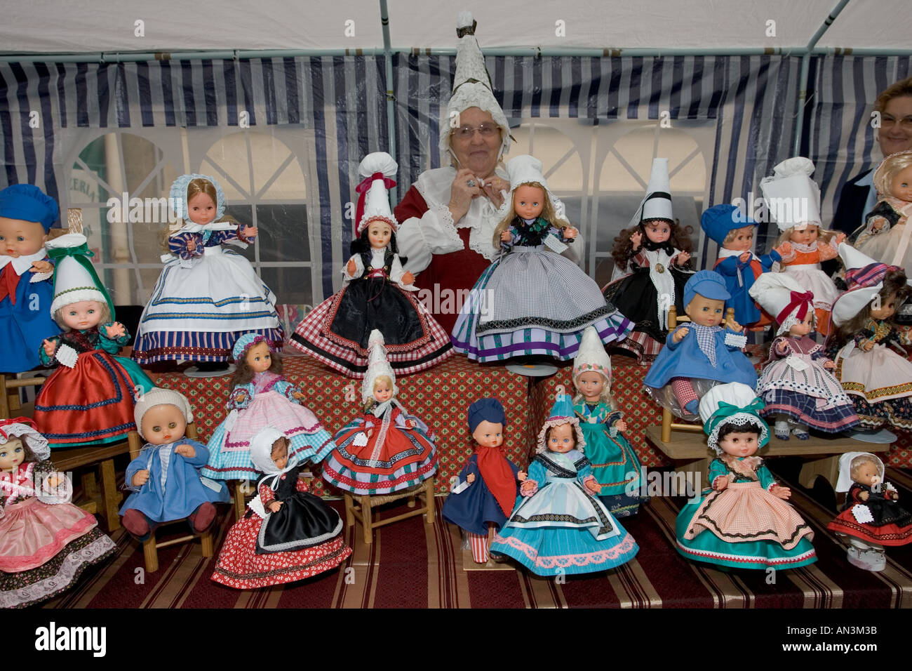French lady with traditional hand made dolls on stall at Cider Fayre ...
