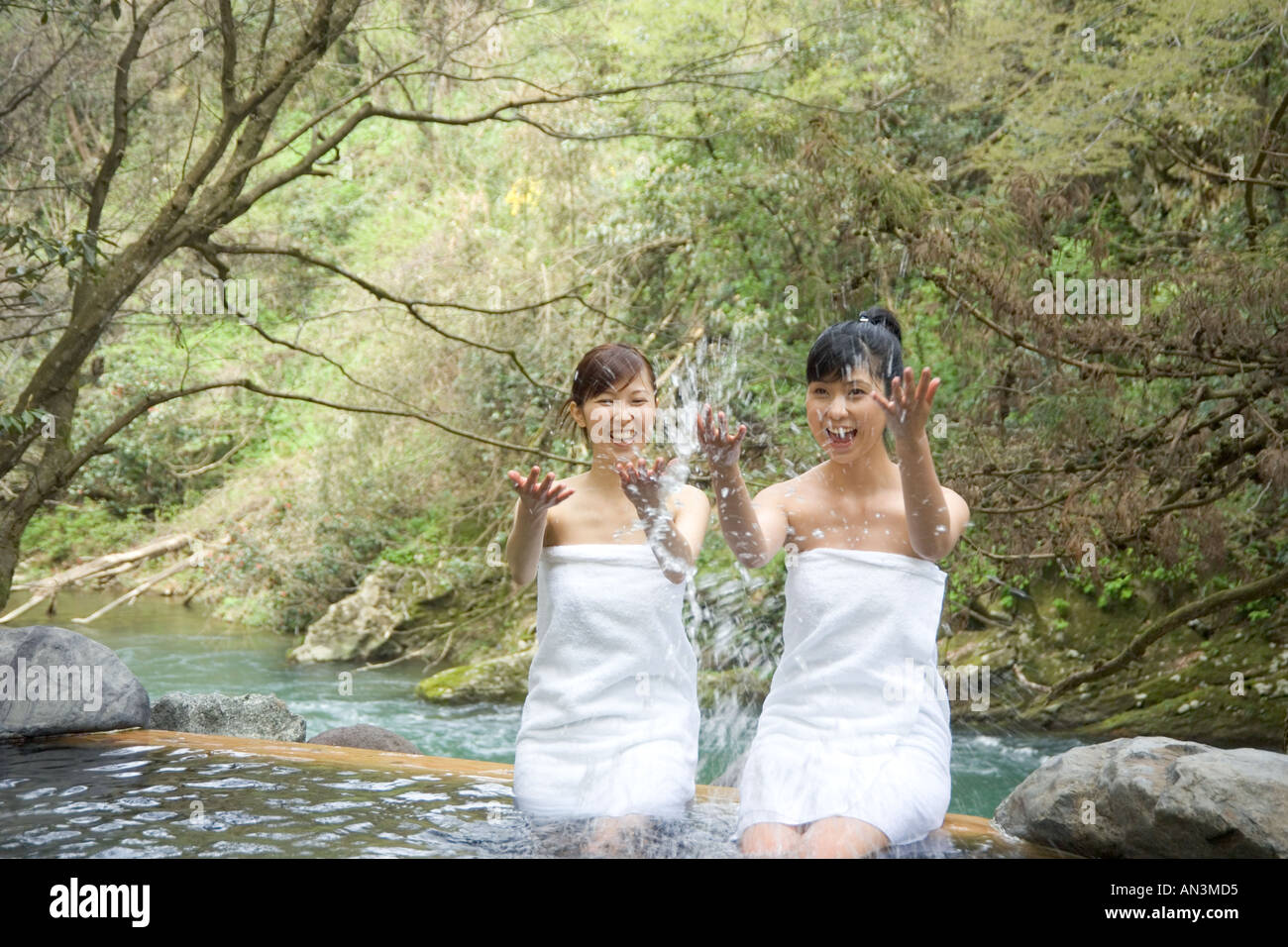 Two young women bathing in hot springs Stock Photo - Alamy