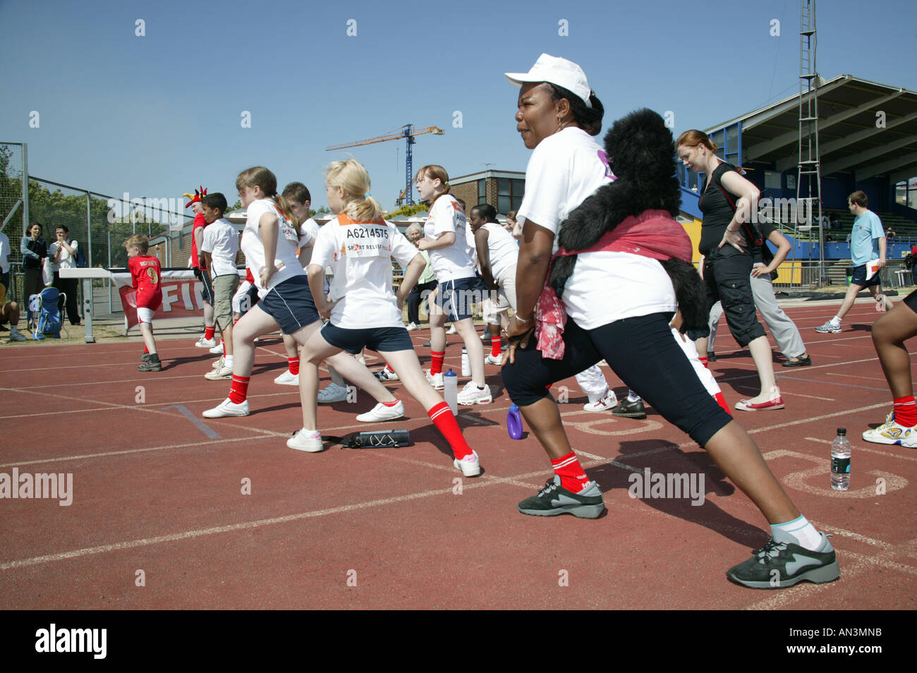 Fun Run on a running track Stock Photo - Alamy