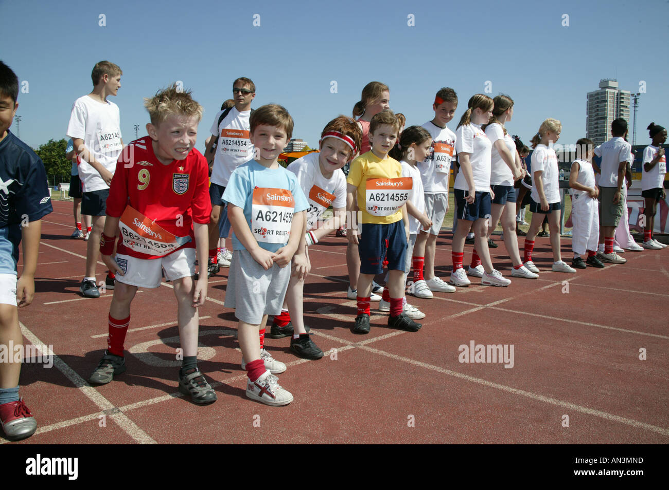 Children on a running track Stock Photo - Alamy