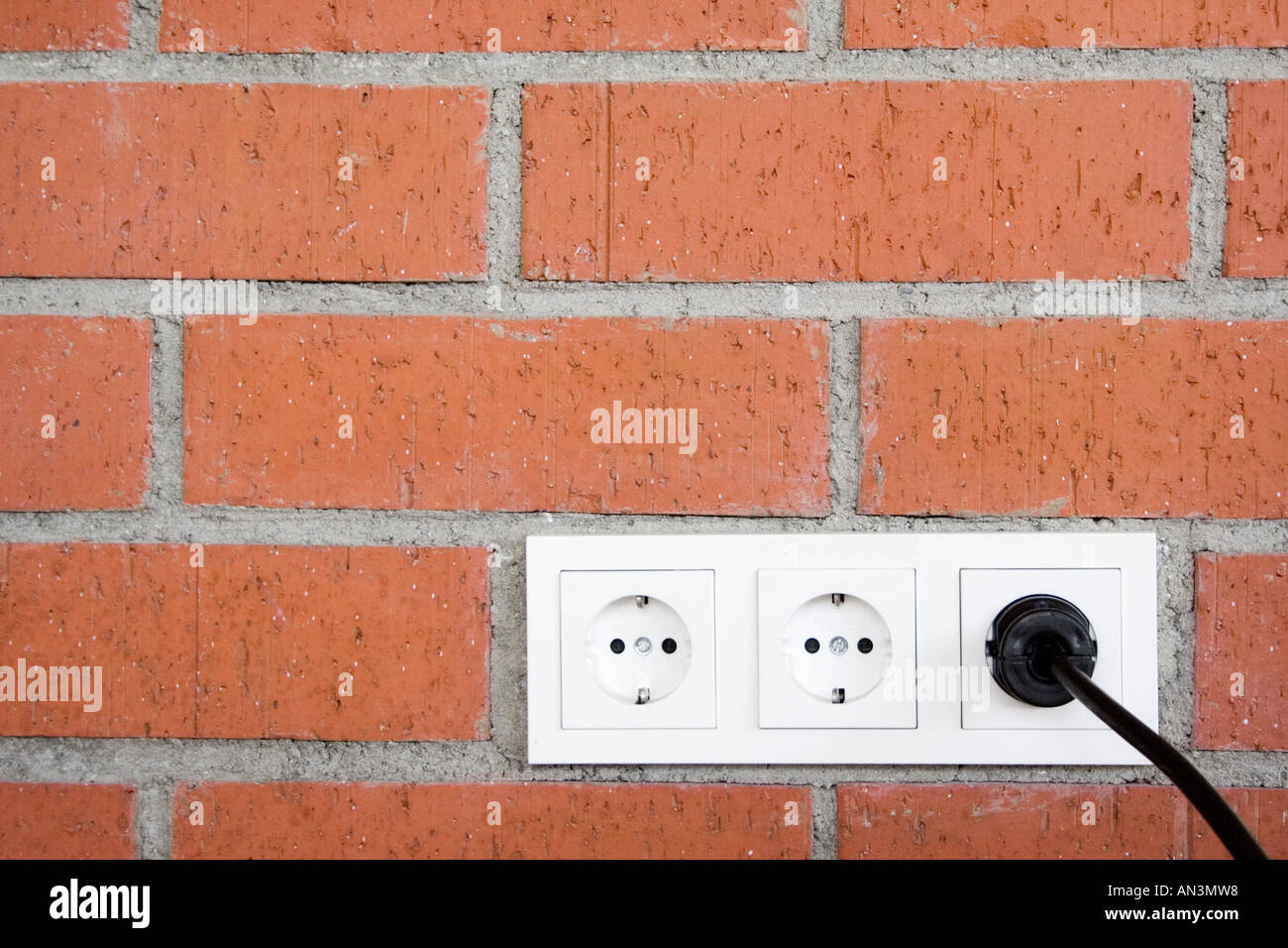 Brick Wall w/ Power Outlet Stock Photo - Alamy
