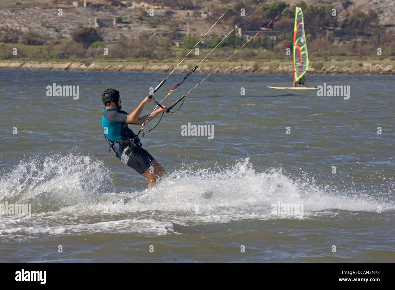 Parasurfer with windsurfer in background Port Leucate southern France ...