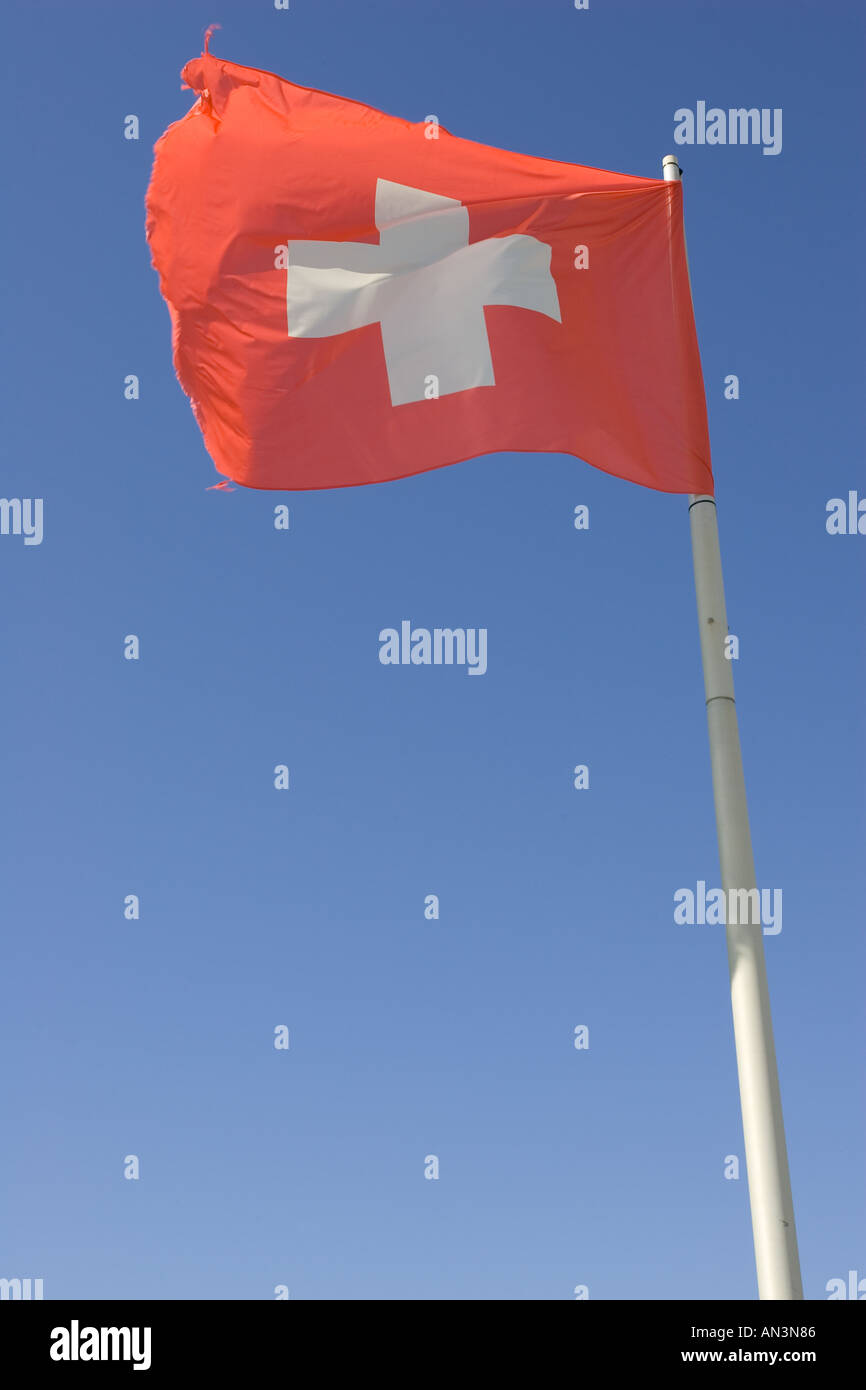 Red cross flag flying against blue sky le Barcares Perpignan southern ...