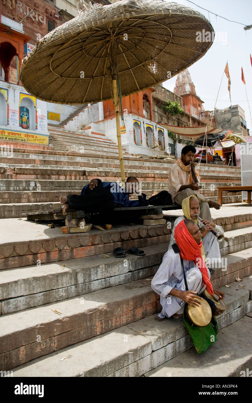 Musicians on the stairs at the shore the Ganges river in Varanasi Stock ...