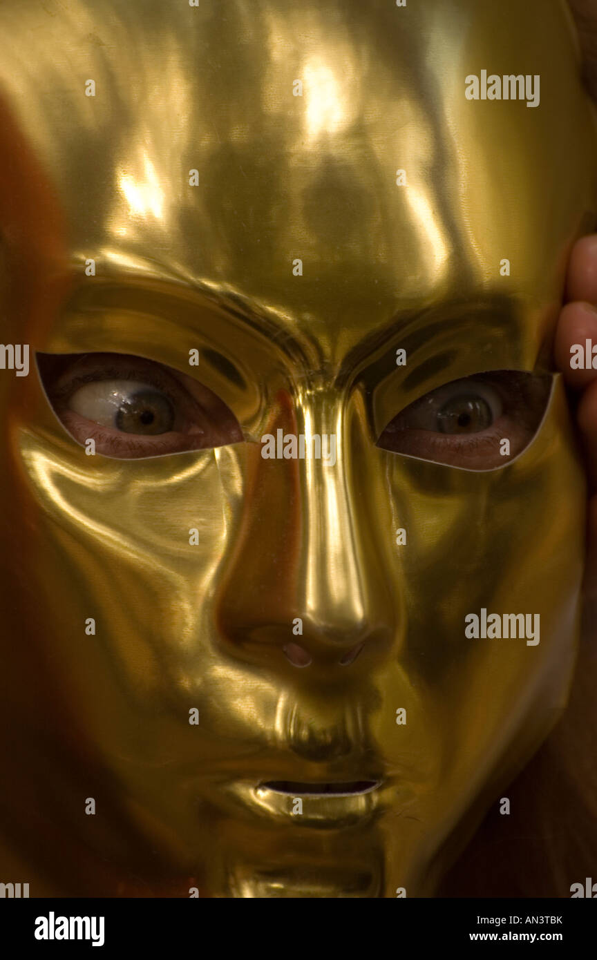 Masked actors gold mask Stock Photo - Alamy