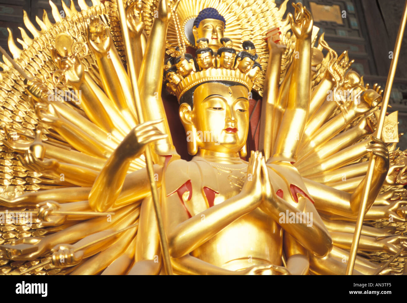 Gold leaf covered buddha with Indian influences many arms on the island ...
