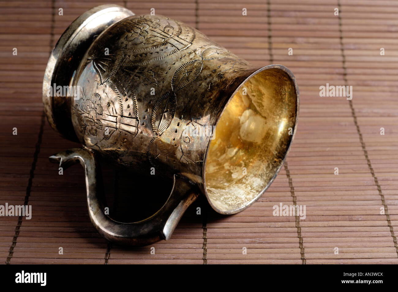 Antique vintage silver tankard close up with a decorative pattern Stock ...