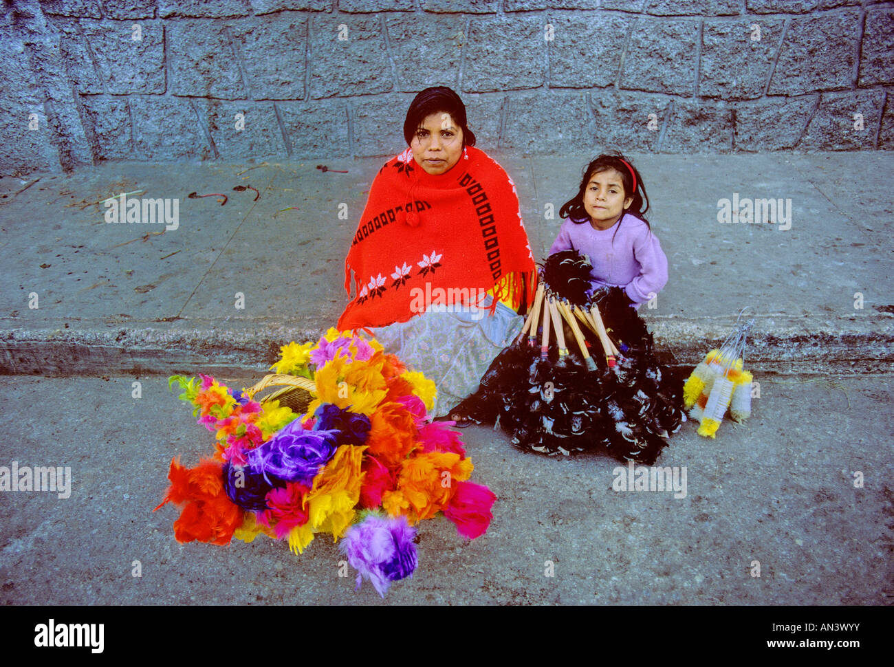 Mother and child selling dusters on a street in Guatemala City Stock ...