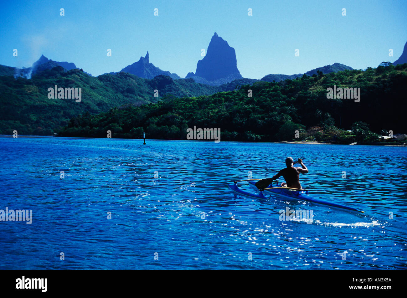 Outrigger canoe paddler Moorea French Polynesia Stock Photo - Alamy