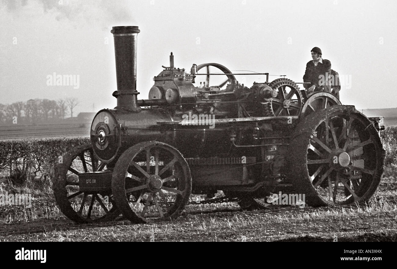 Traction engine in motion with man driving at ploughing festival Stock ...