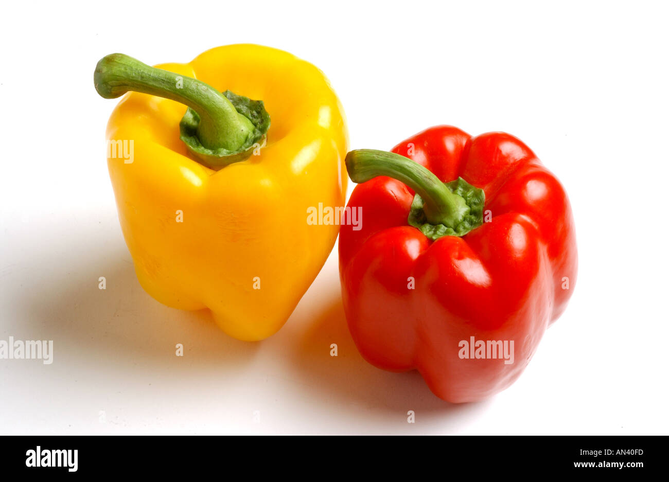 Square color image of a red bell pepper sitting on a plain white ...