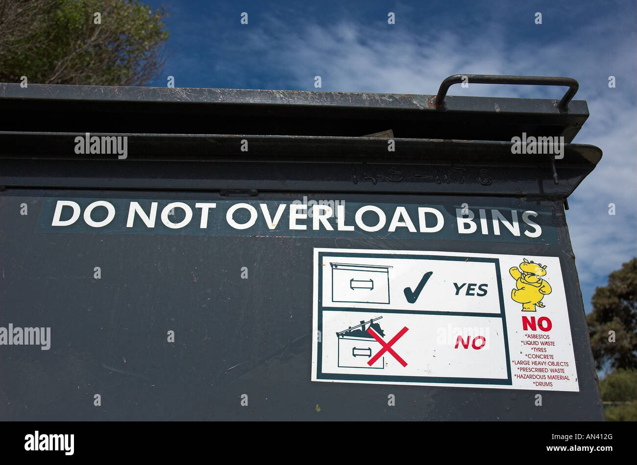 Large bin with sign indicating what may not be disposed of in it Stock ...