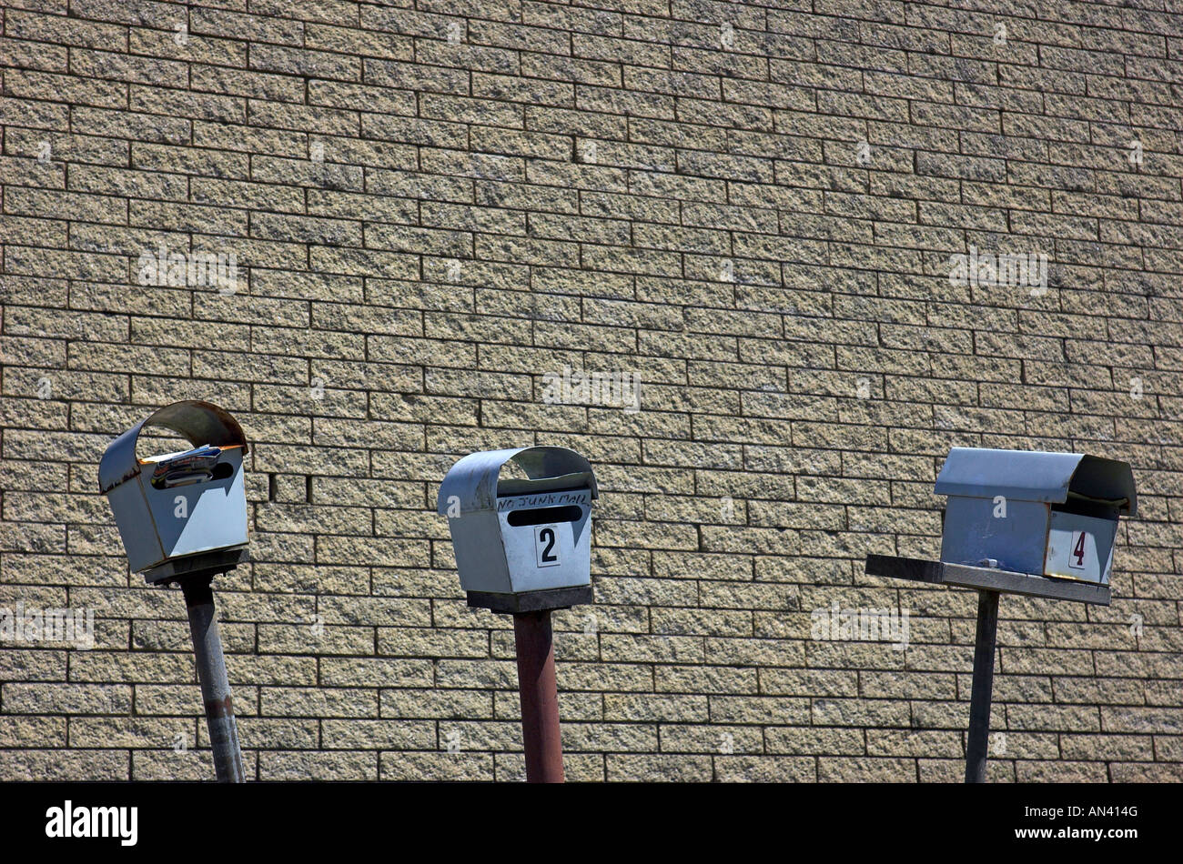 Three individual mail boxes in poor condition Stock Photo - Alamy