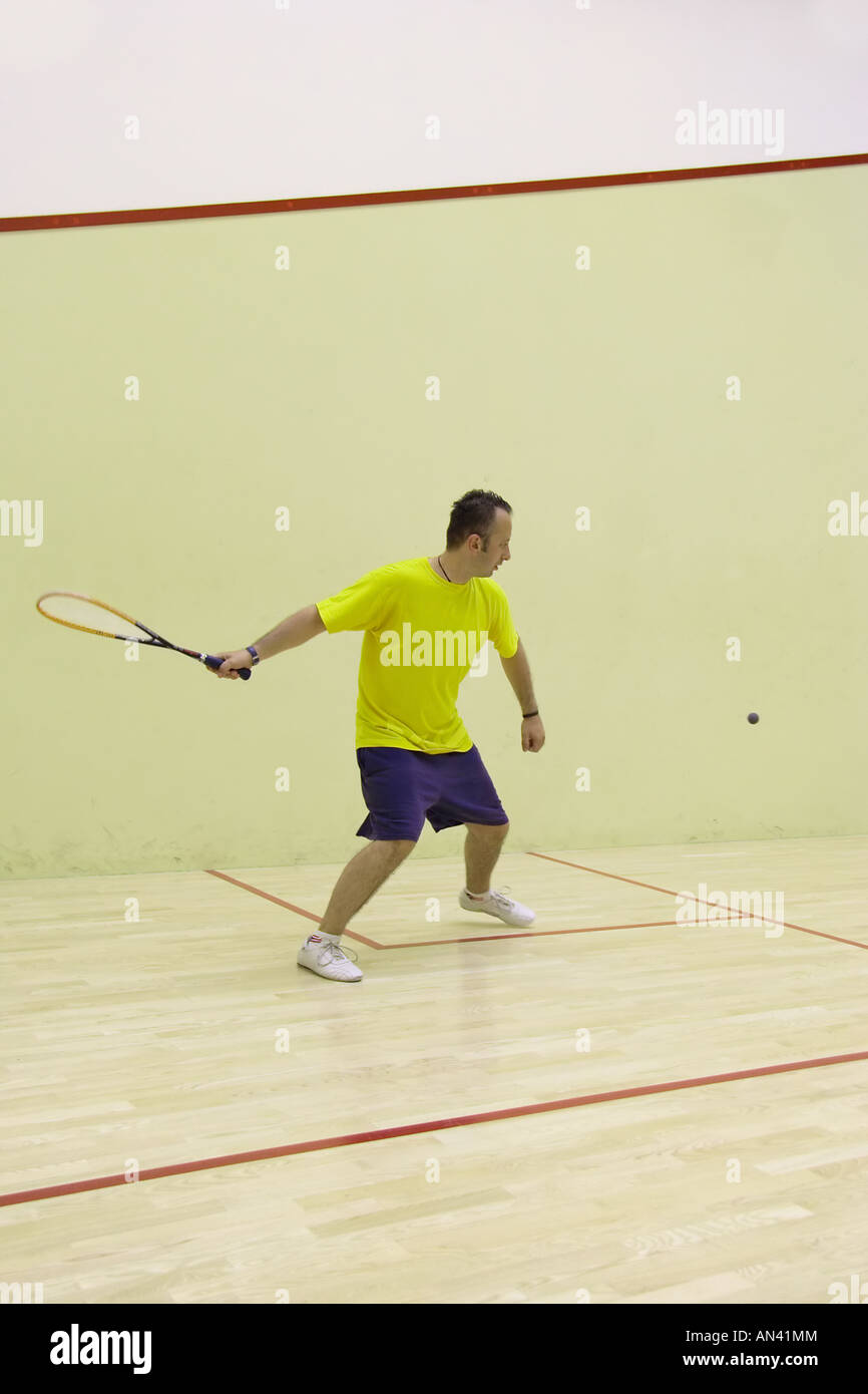 Young man playing squash Stock Photo - Alamy