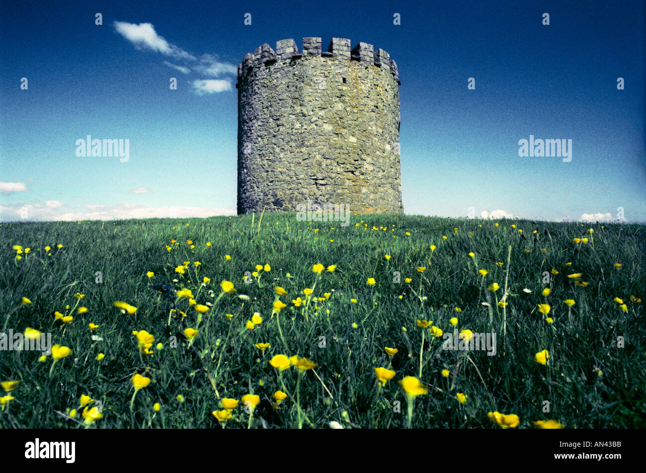 An old windmill that has been turned into a castle like folly near ...