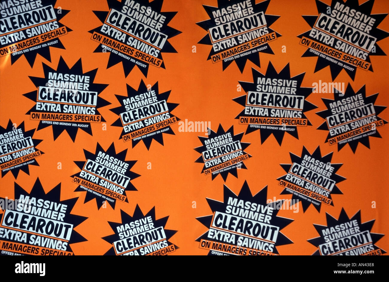 High street shop window glass covered with posters advertising special ...