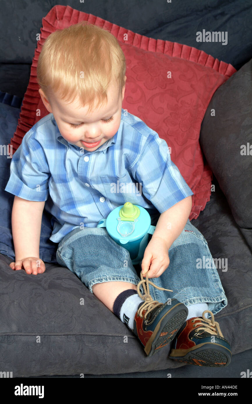 Little Boy tying Shoe Laces Stock Photo - Alamy