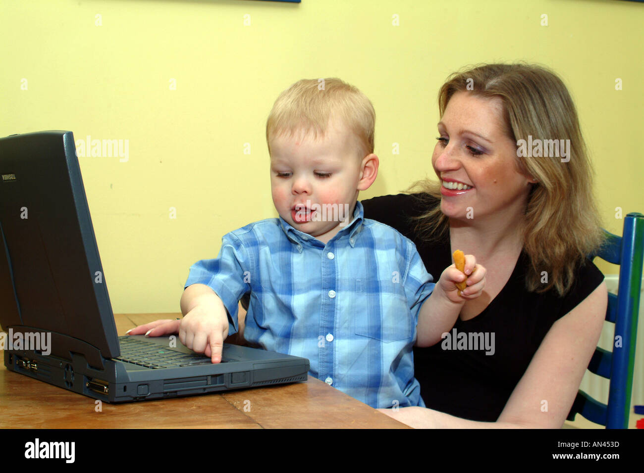 Child and Mother Using Laptop Computer Stock Photo - Alamy