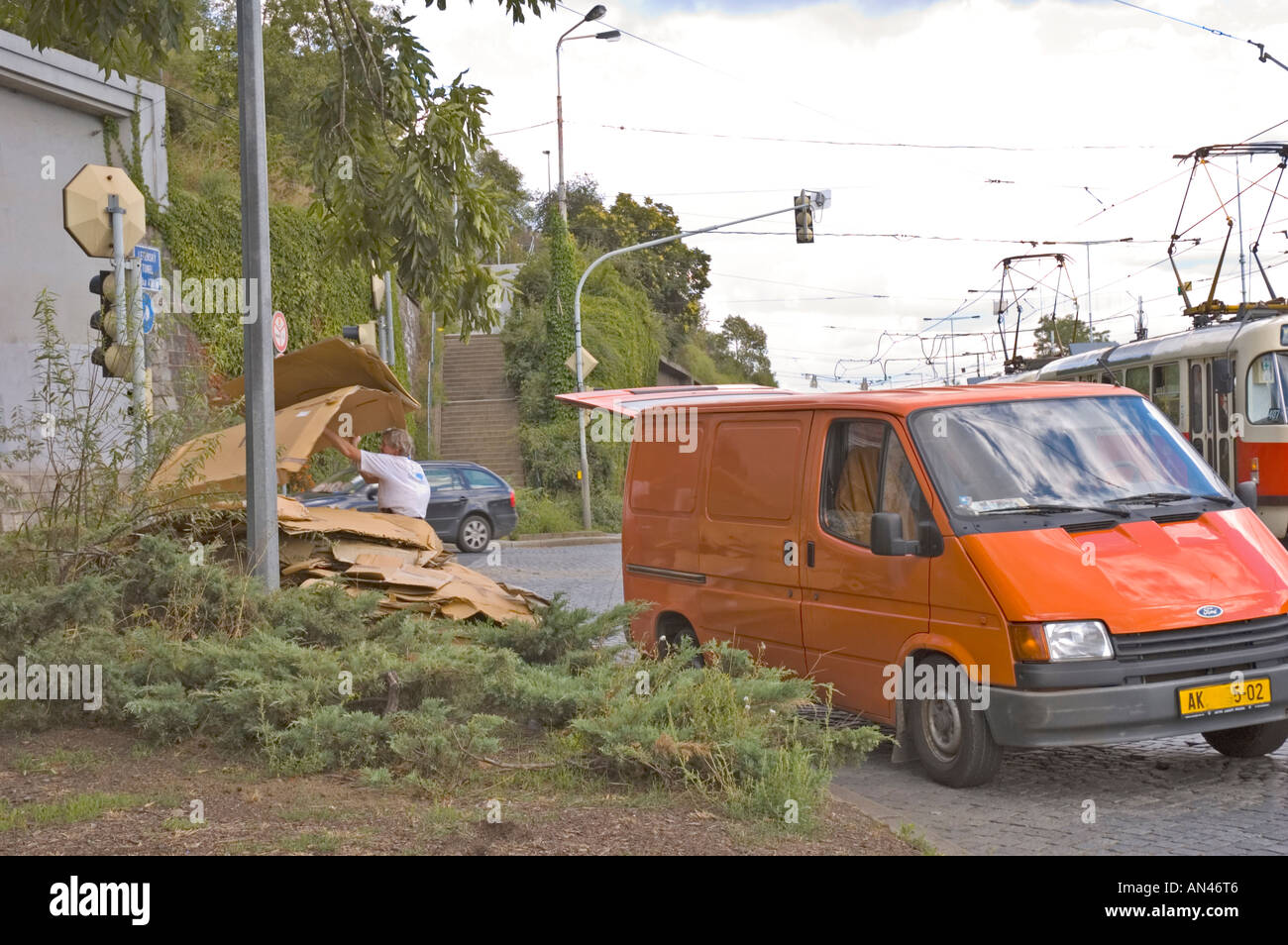 Man dumping cardboard in Prague Stock Photo - Alamy